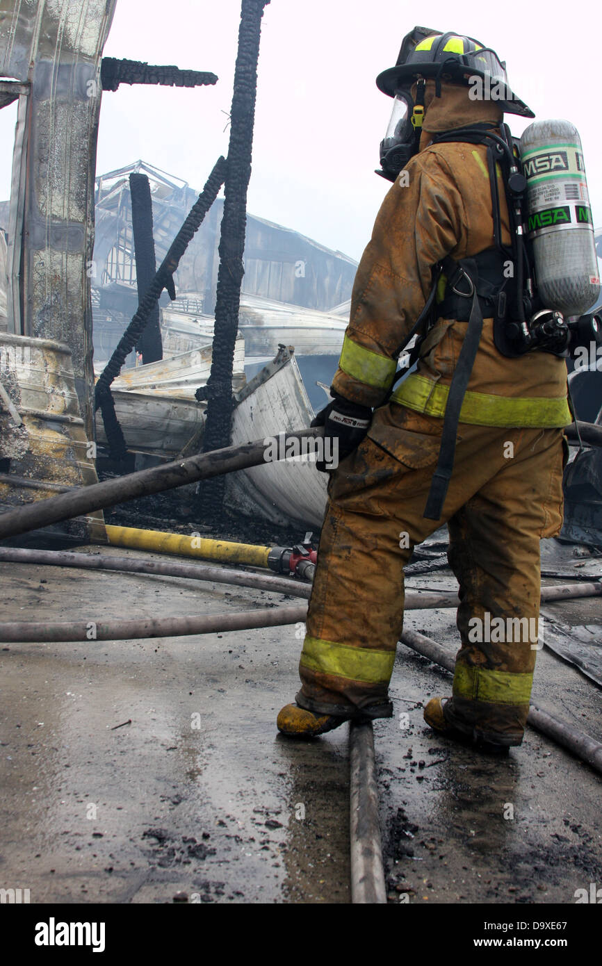 A woman firefighter working on a fire scene in Wisconsin Stock Photo ...