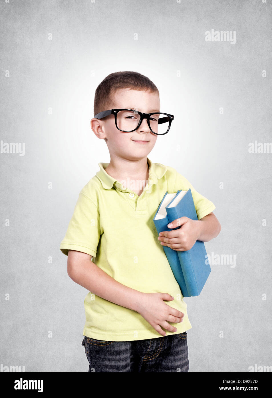 Smart boy holding the books Stock Photo - Alamy
