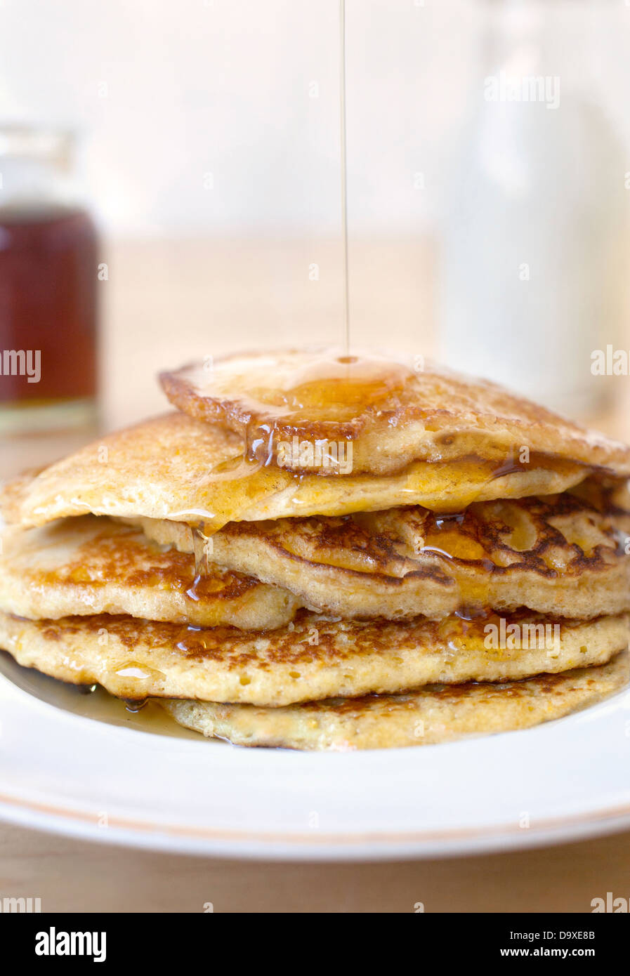 Pancakes with maple syrup drip Stock Photo - Alamy