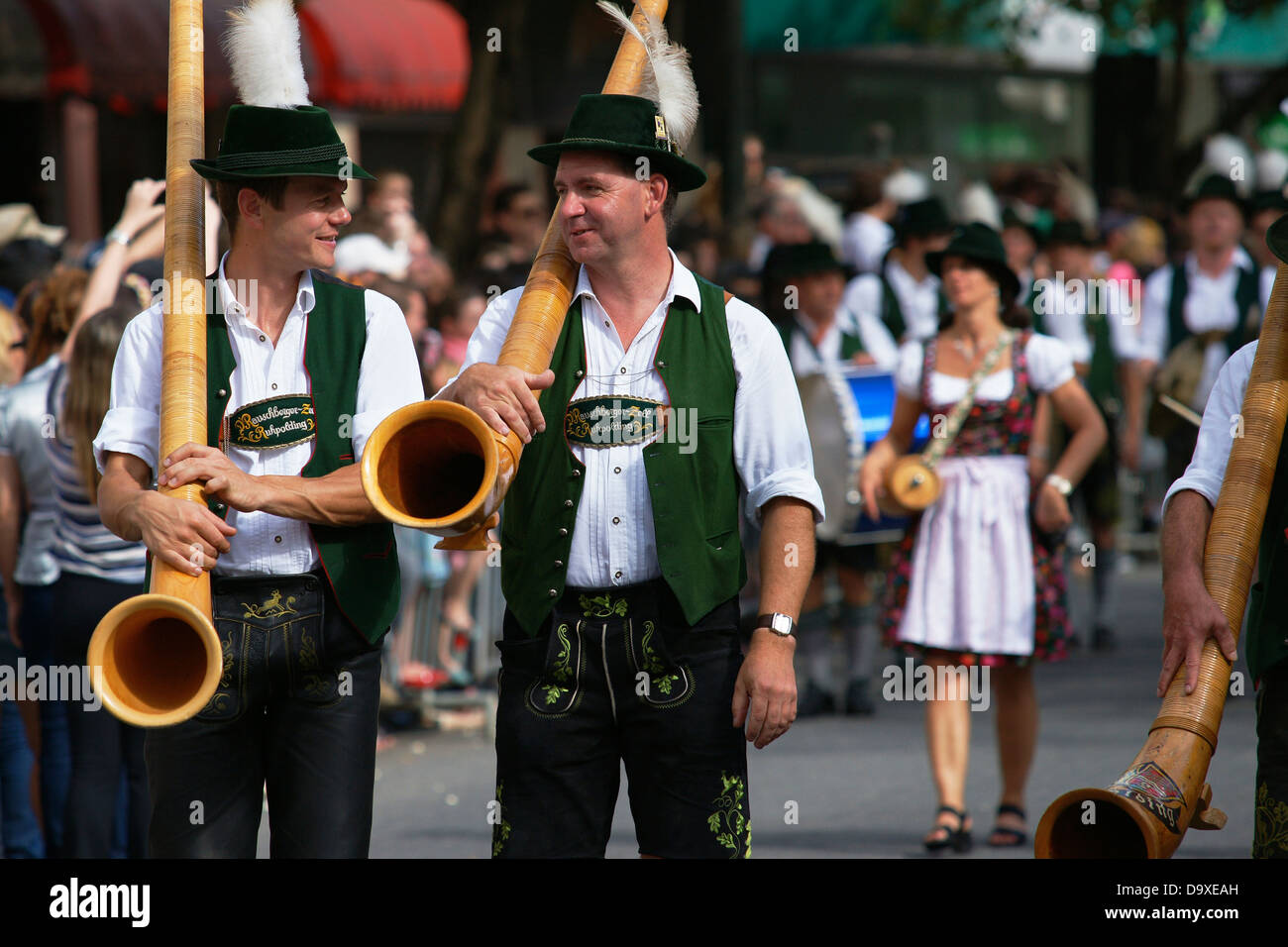 Bavarian guest musicians carrying their Alphorn instruments during the ...