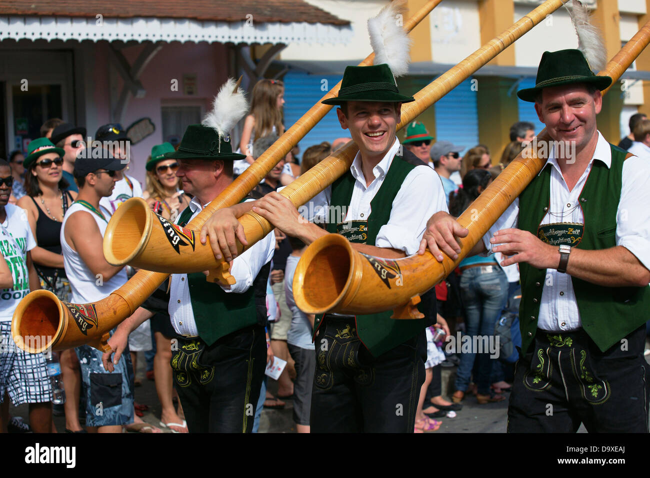 Bavarian guest musicians carrying their Alphorn instruments during the ...