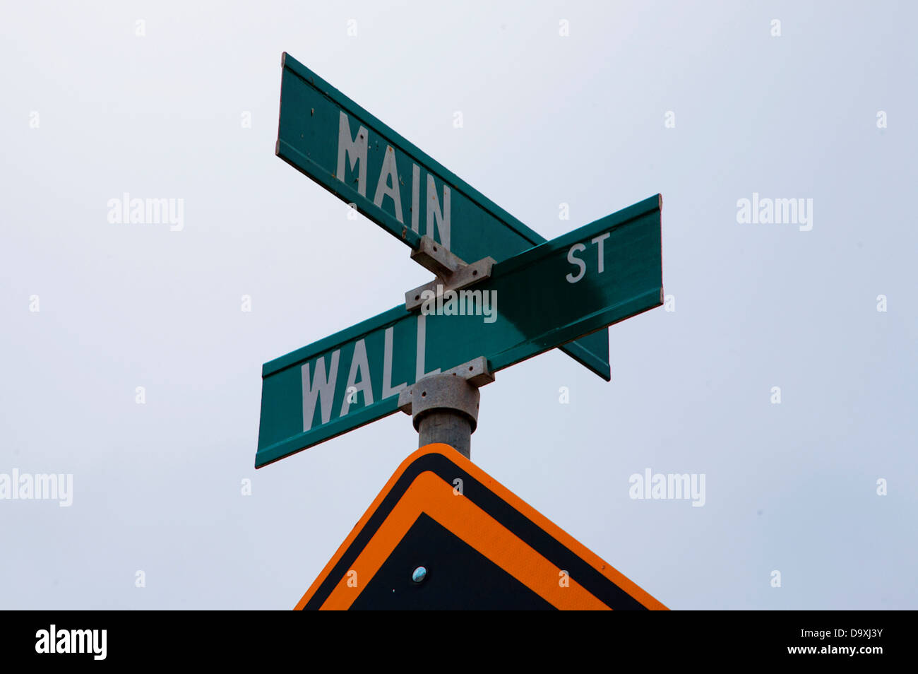 A road sign is the intersection of Main Street and Wall Street, Central ...