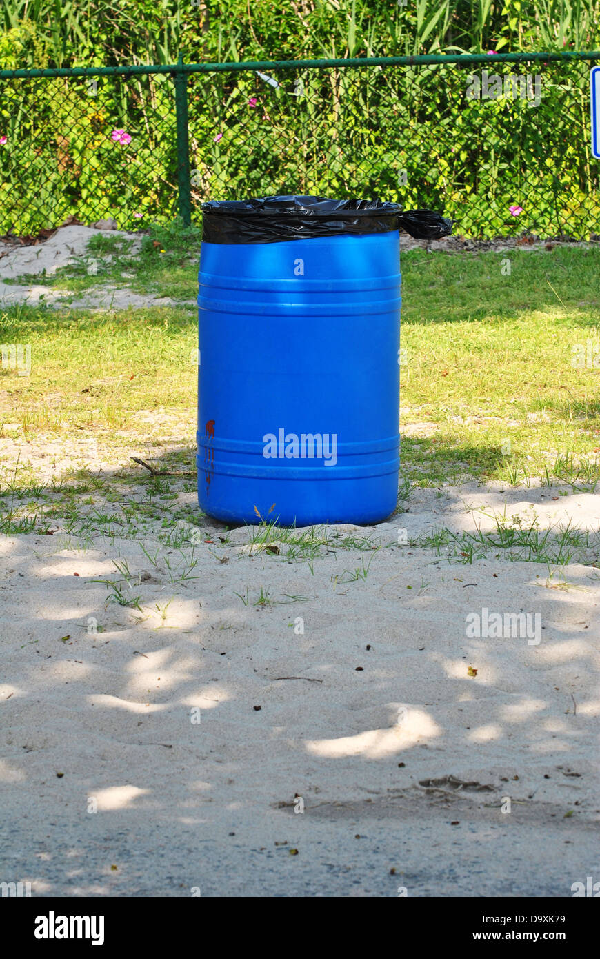 Blue Garbage Can at a Park Stock Photo - Alamy