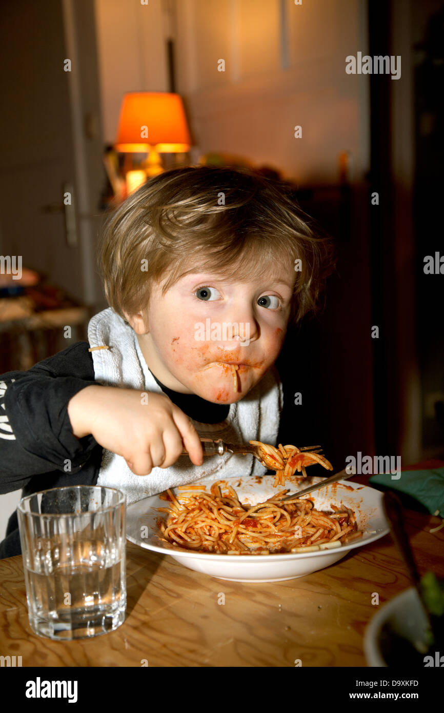 Germany, Boy eating spaghetti, close up Stock Photo - Alamy