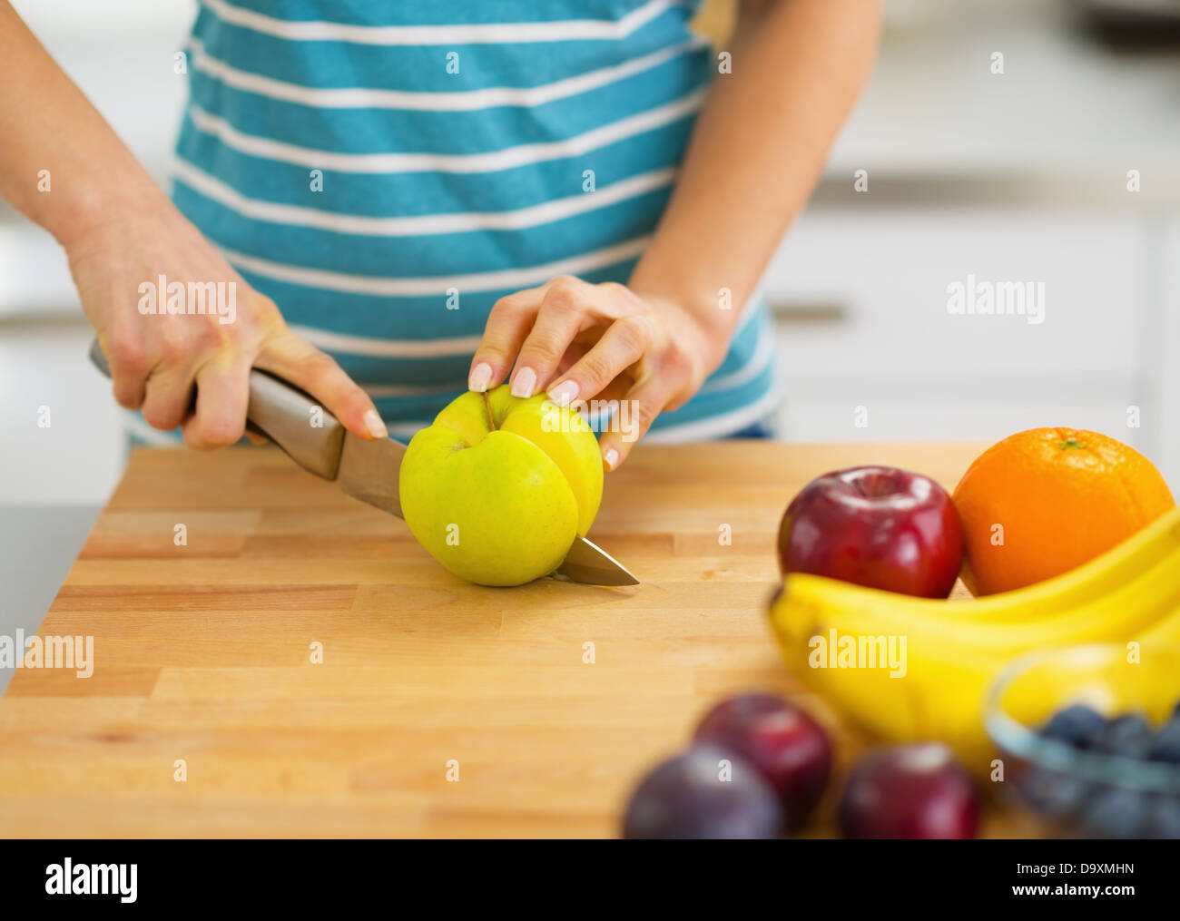 Woman eating apple slice hi-res stock photography and images - Alamy