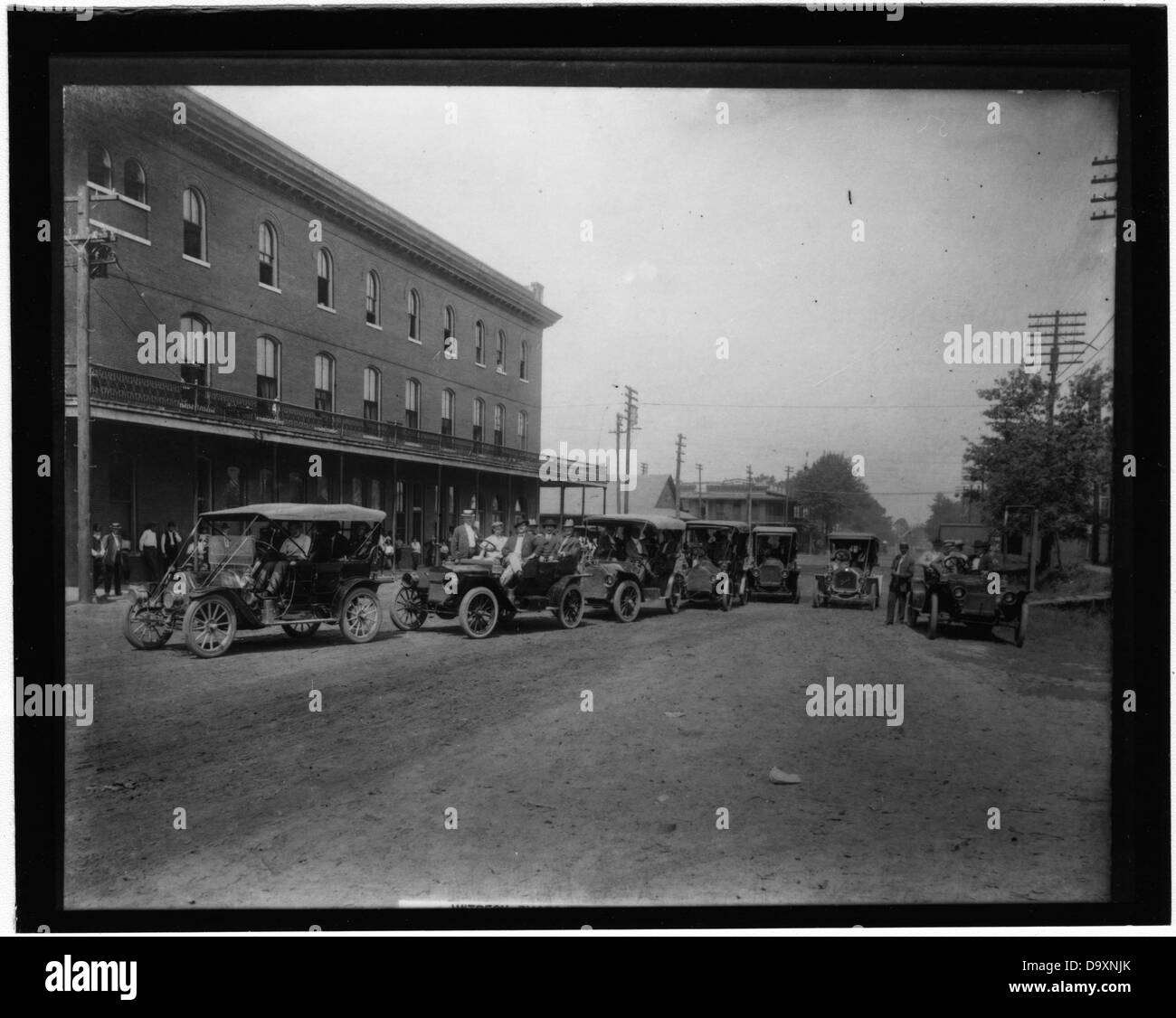 A historical photograph from Brookhaven, featuring cars outside the ...