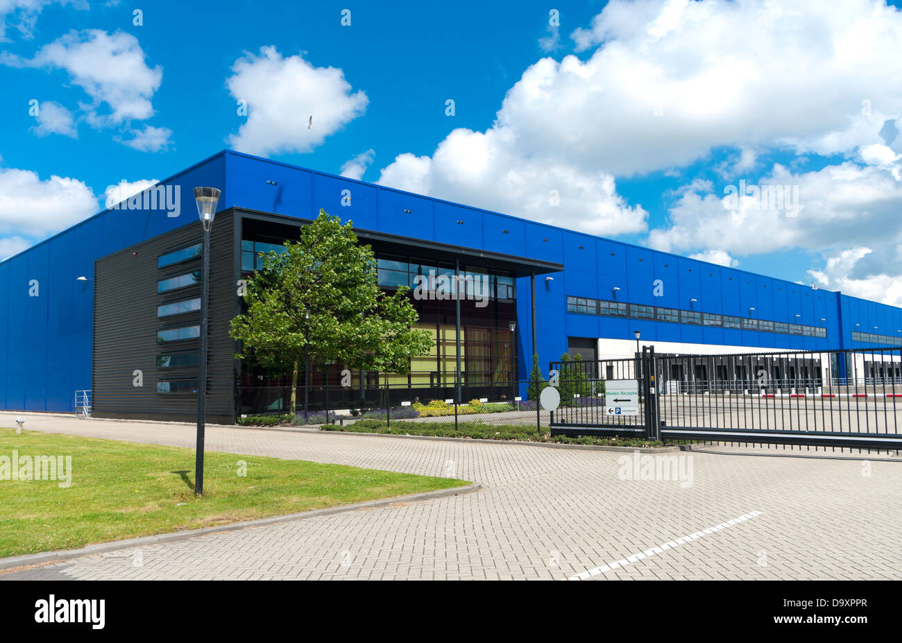 modern blue warehouse in the Rotterdam harbor area Stock Photo - Alamy