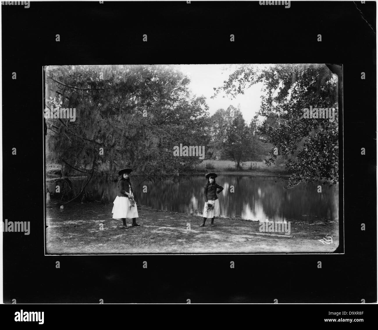 This photograph shows two unidentified girls, capturing a moment from ...
