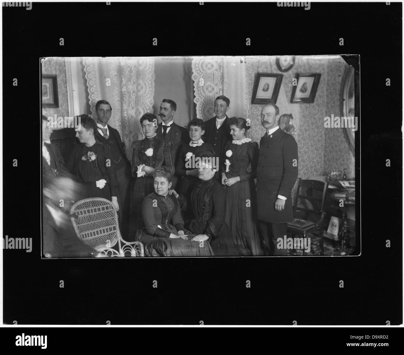 A photograph of an unidentified group of people. The individuals in the ...