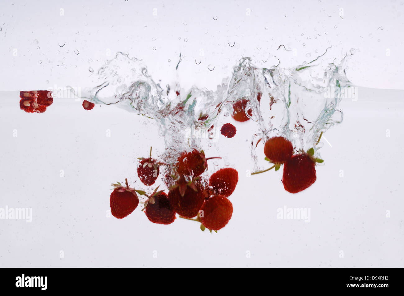 Strawberries in water Stock Photo - Alamy