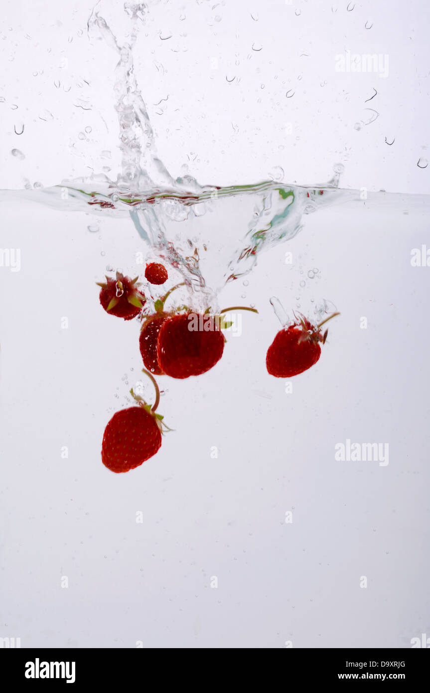 Strawberries in water Stock Photo - Alamy