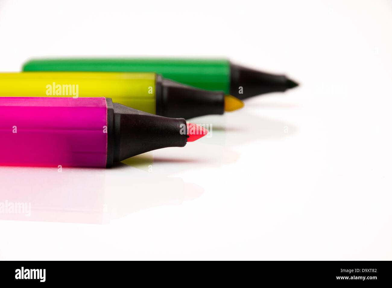 colored markers on a white background Stock Photo - Alamy