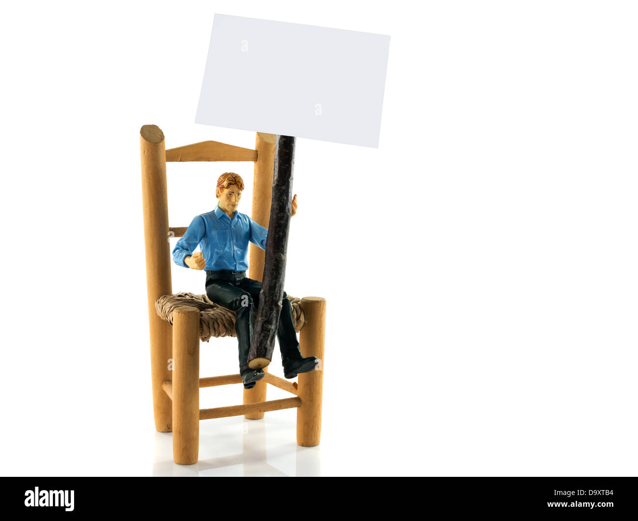 puppet toy man sitting on chair with information board Stock Photo - Alamy