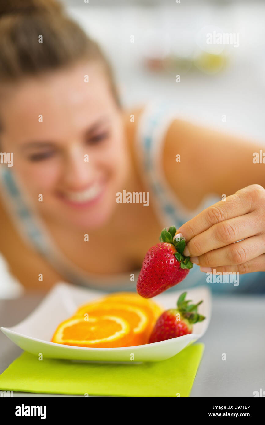 Woman decorating dish hi-res stock photography and images - Alamy