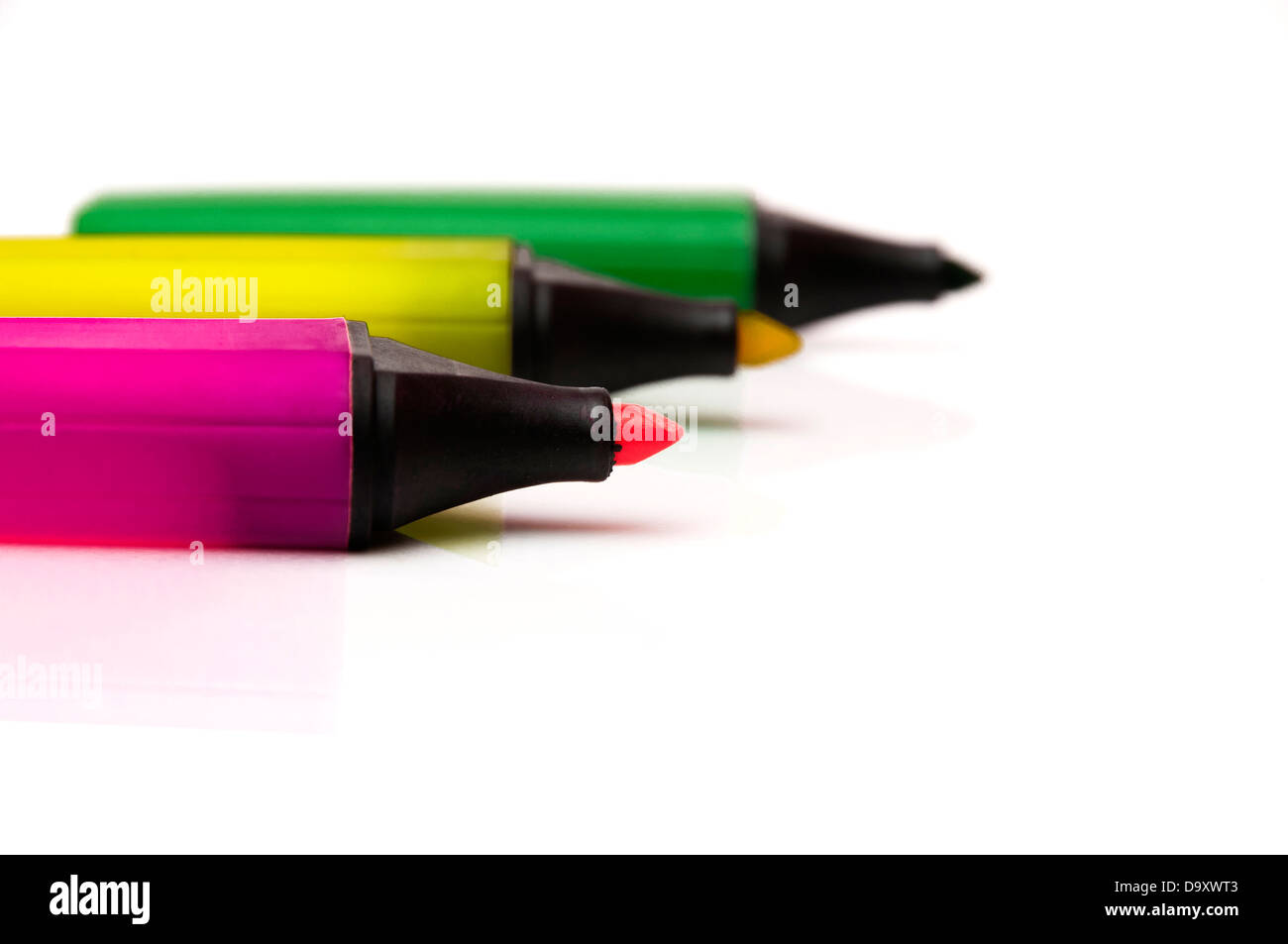 colored markers on a white background Stock Photo - Alamy