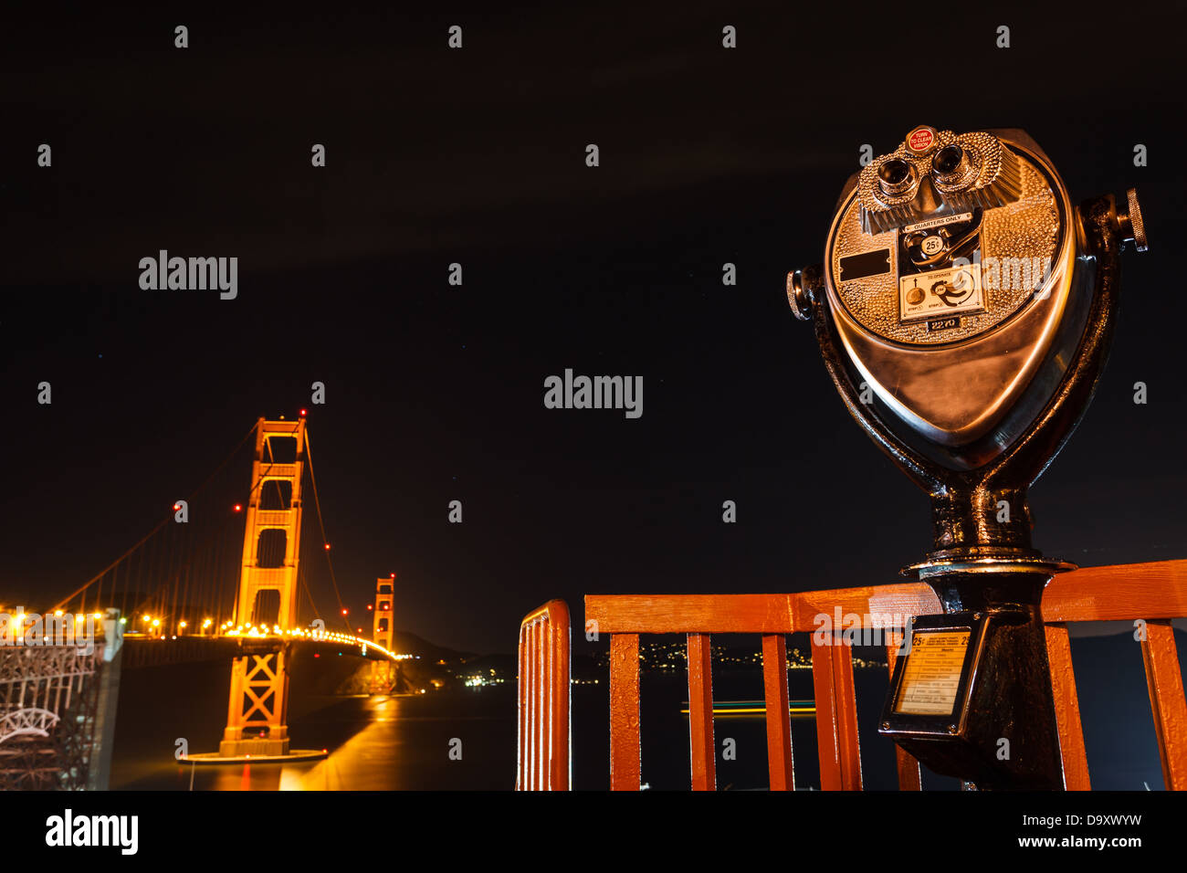 View of Bay Bridge San Francisco lit up at night from waterfront park ...
