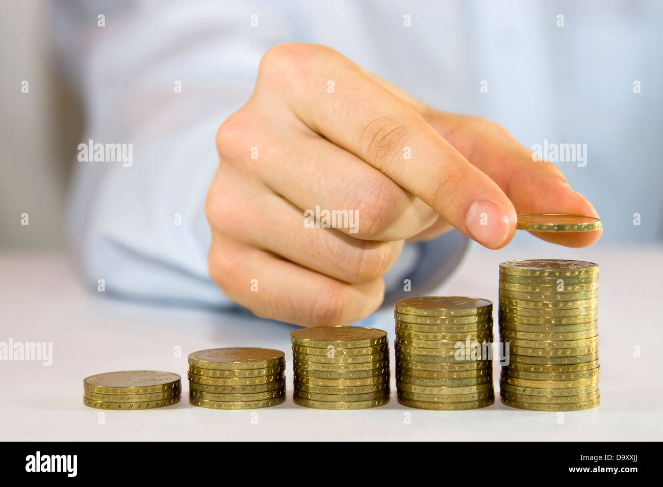 Coins stacks building hi-res stock photography and images - Alamy
