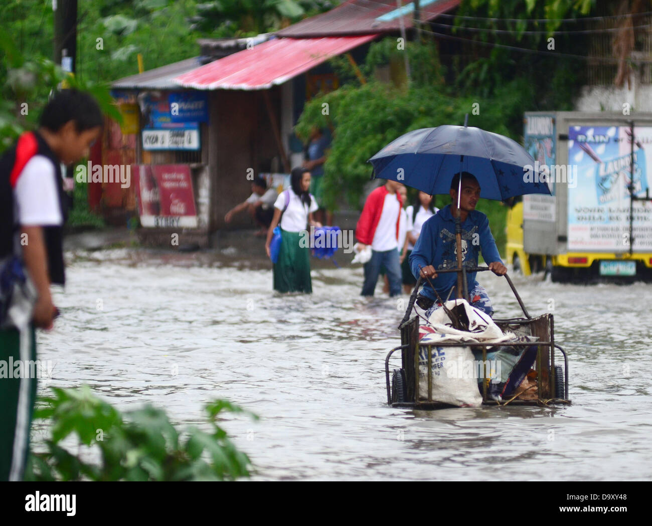 Davao, Philipinnes. 28th June 2013. Filipino residents maneuvers as ...