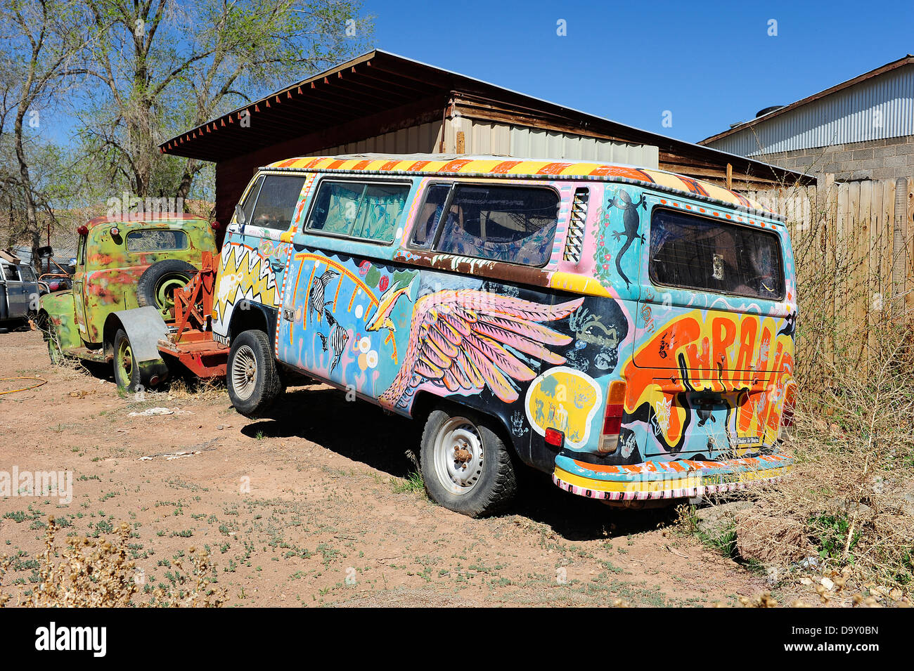 Painted Volkswagen camper van held up by breakdown truck, Moab, Utah ...