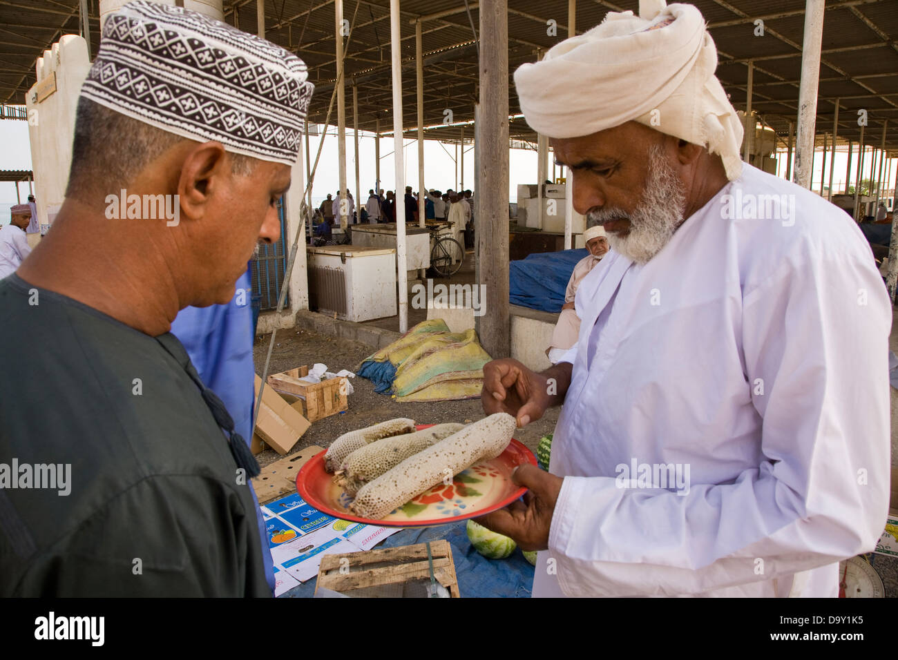 This vendor sells comb honey in a market in the Parka District of ...