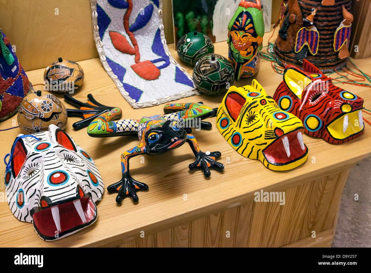 Colorful display masks statues carved hi-res stock photography and ...