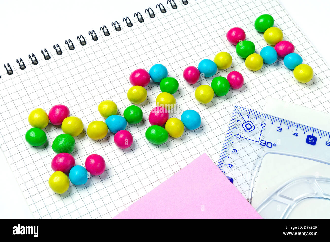 Colored candy in shape numerals two plus two Stock Photo - Alamy