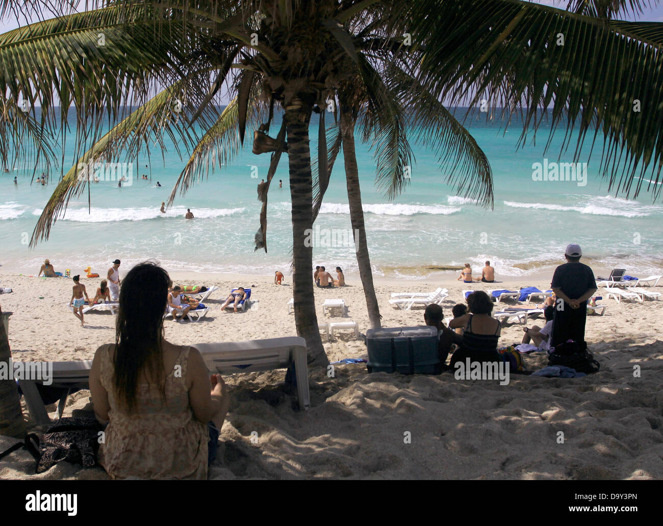 Vacationers and palm trees on the beach of Varadero, Cuba, 21 April ...