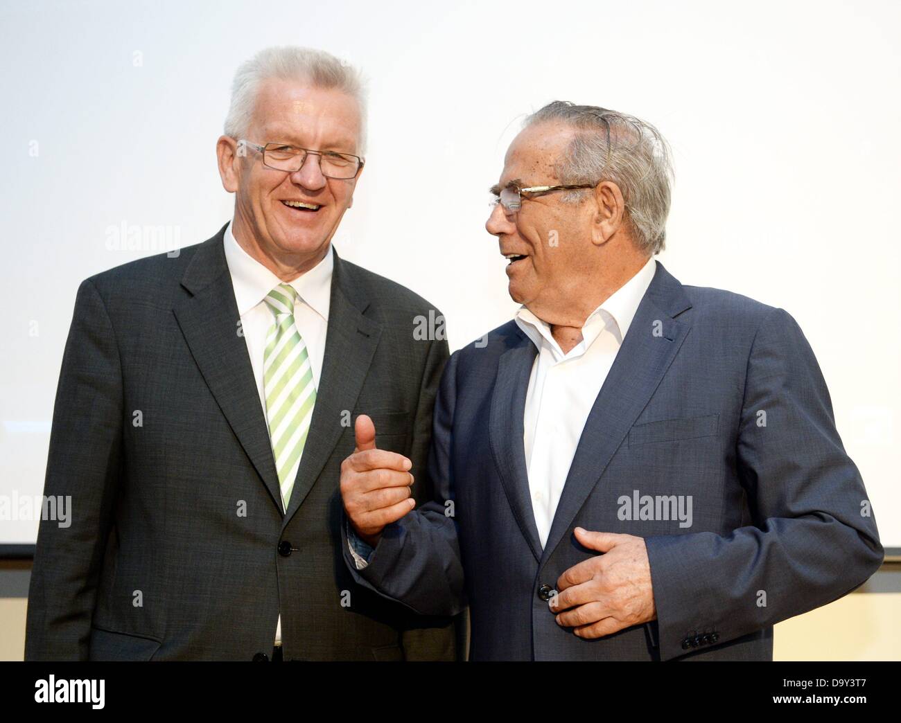 Premier of Baden-Wuerttemberg Winfried Kretschmann (L) stands with Stef ...