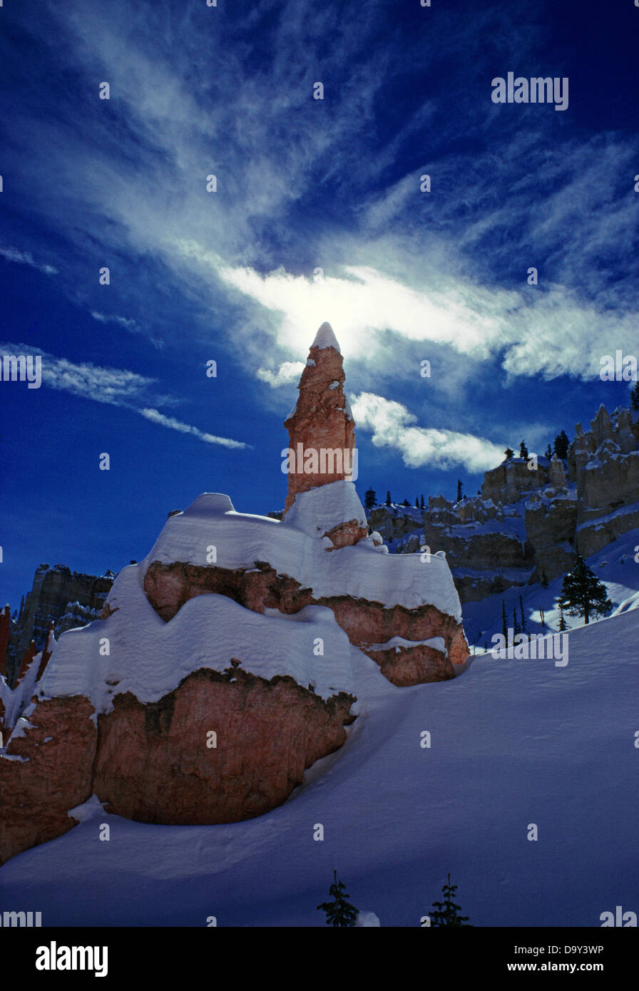 Sunlight cirrus clouds silhouetting Claron Formation hoodoo along Peek ...