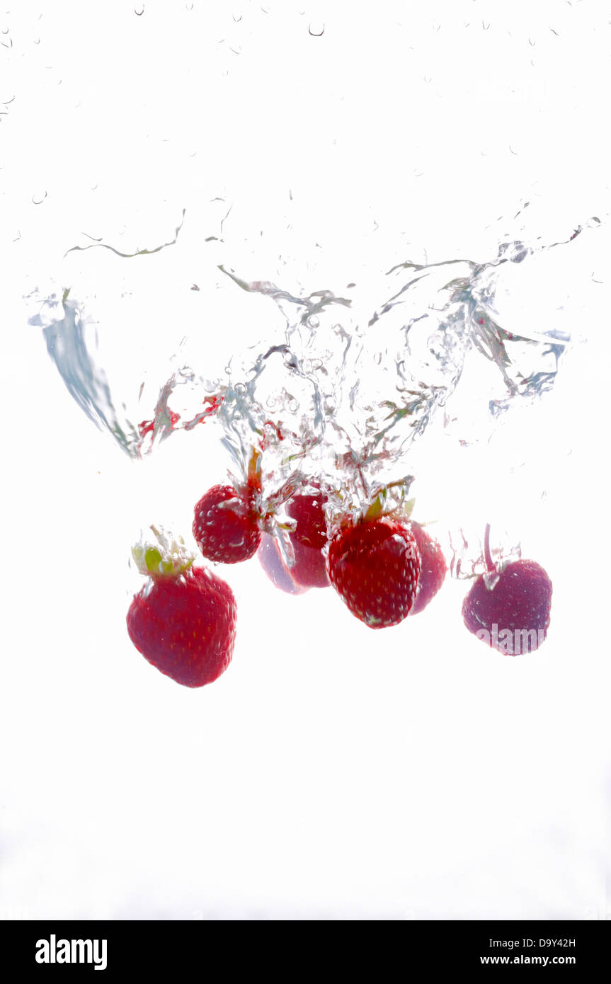 Strawberries in water Stock Photo - Alamy