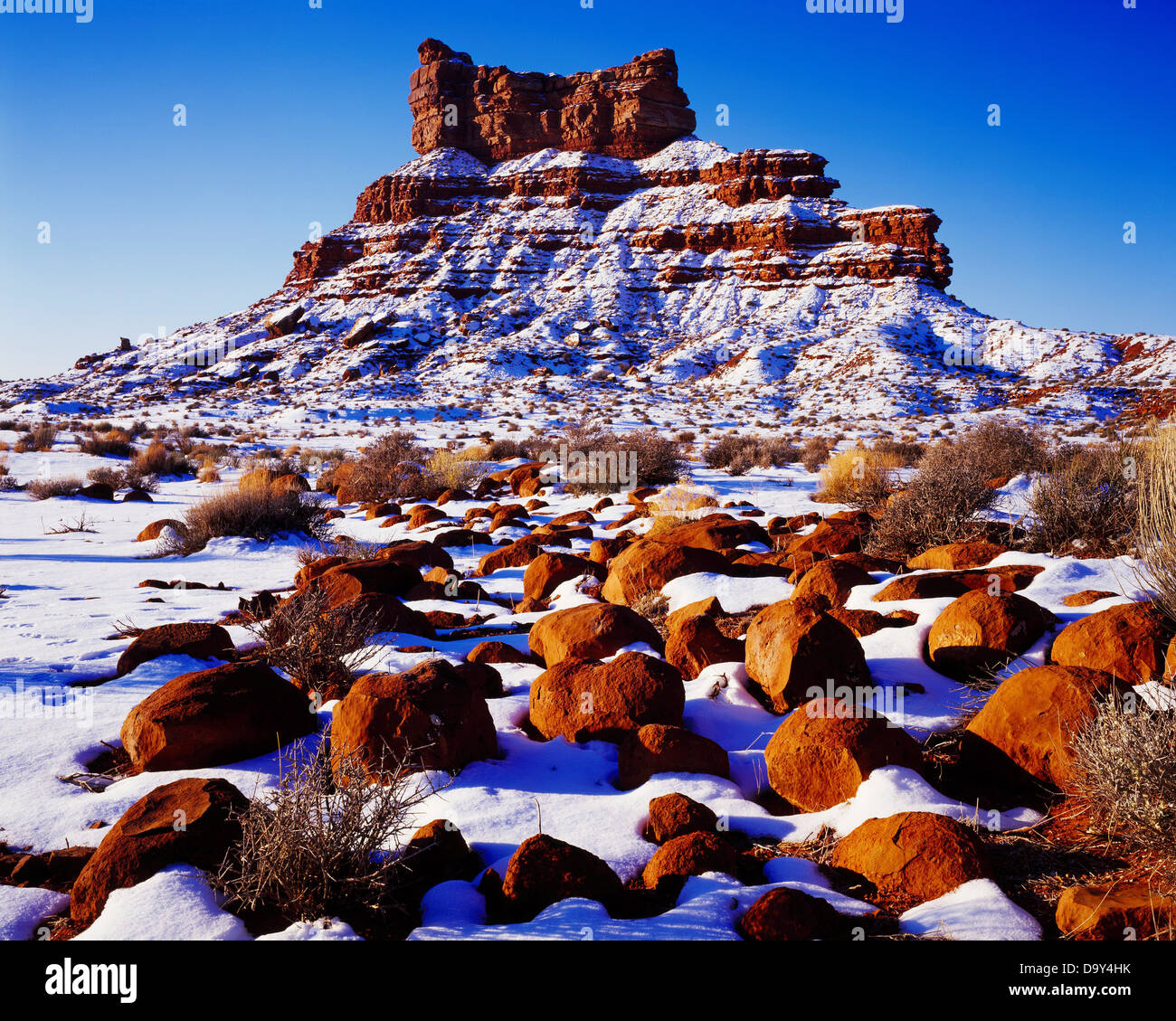 Winter view of sandstone boulders and Setting Hen Butte, Valley of the ...