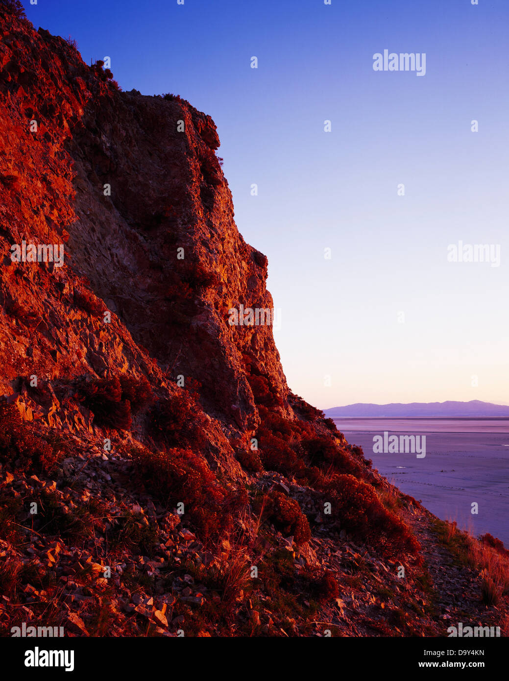 Sunset light illuminating Lone Rock at Monument Point, Spring Bay ...