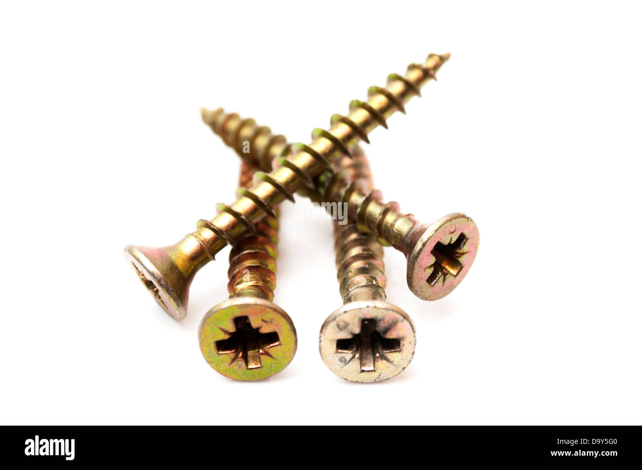 golden screws on a white background Stock Photo - Alamy