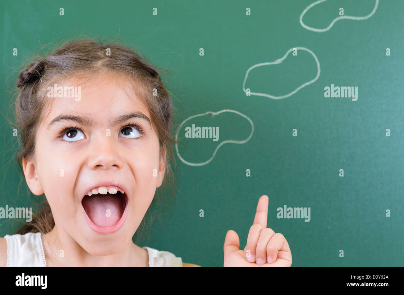 Girl having a message on chalkboard Stock Photo - Alamy