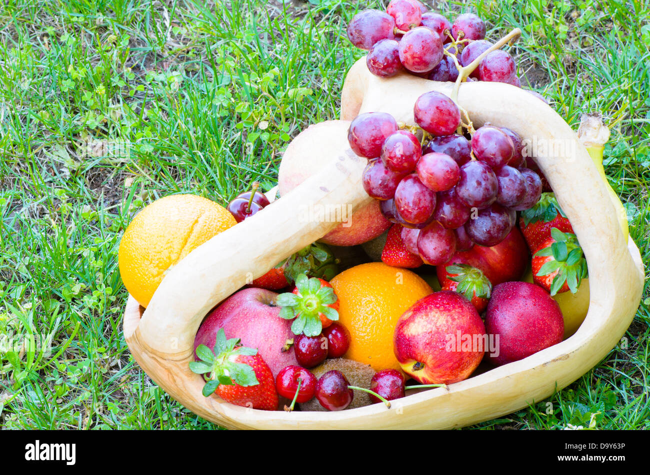 Rustic basket with fruits Stock Photo - Alamy