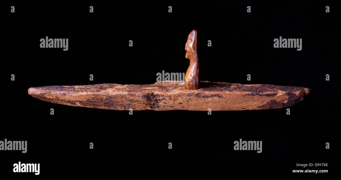 USA, Alaska, St. Lawrence Island, Okvik ivory human figure in wooden ...