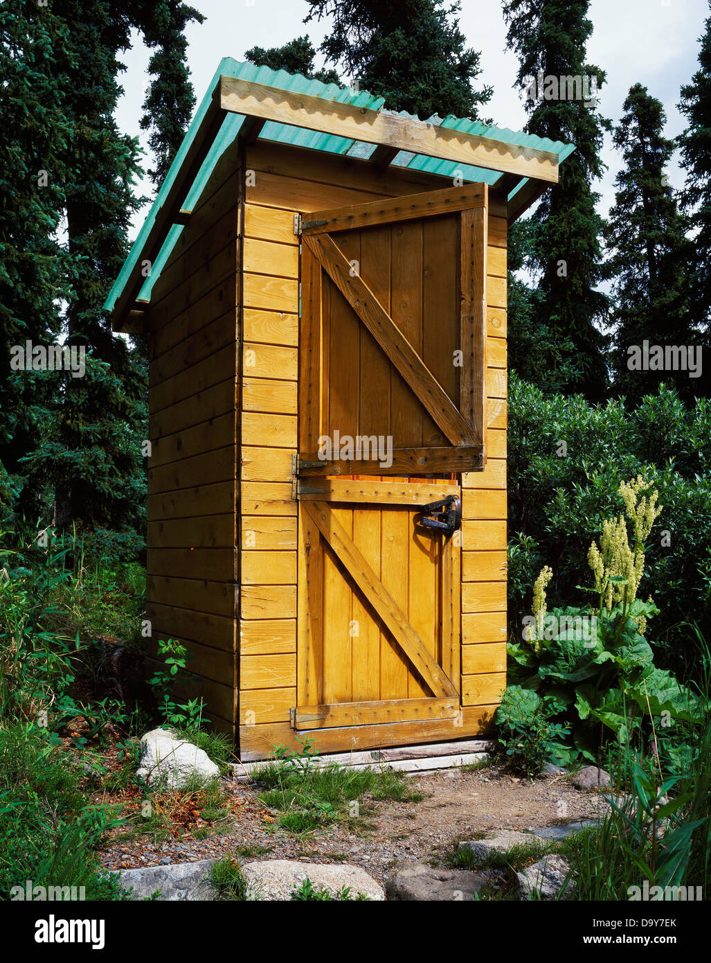 USA, Alaska, Lake Clark National Park, Outhouse with dutch doors and ...