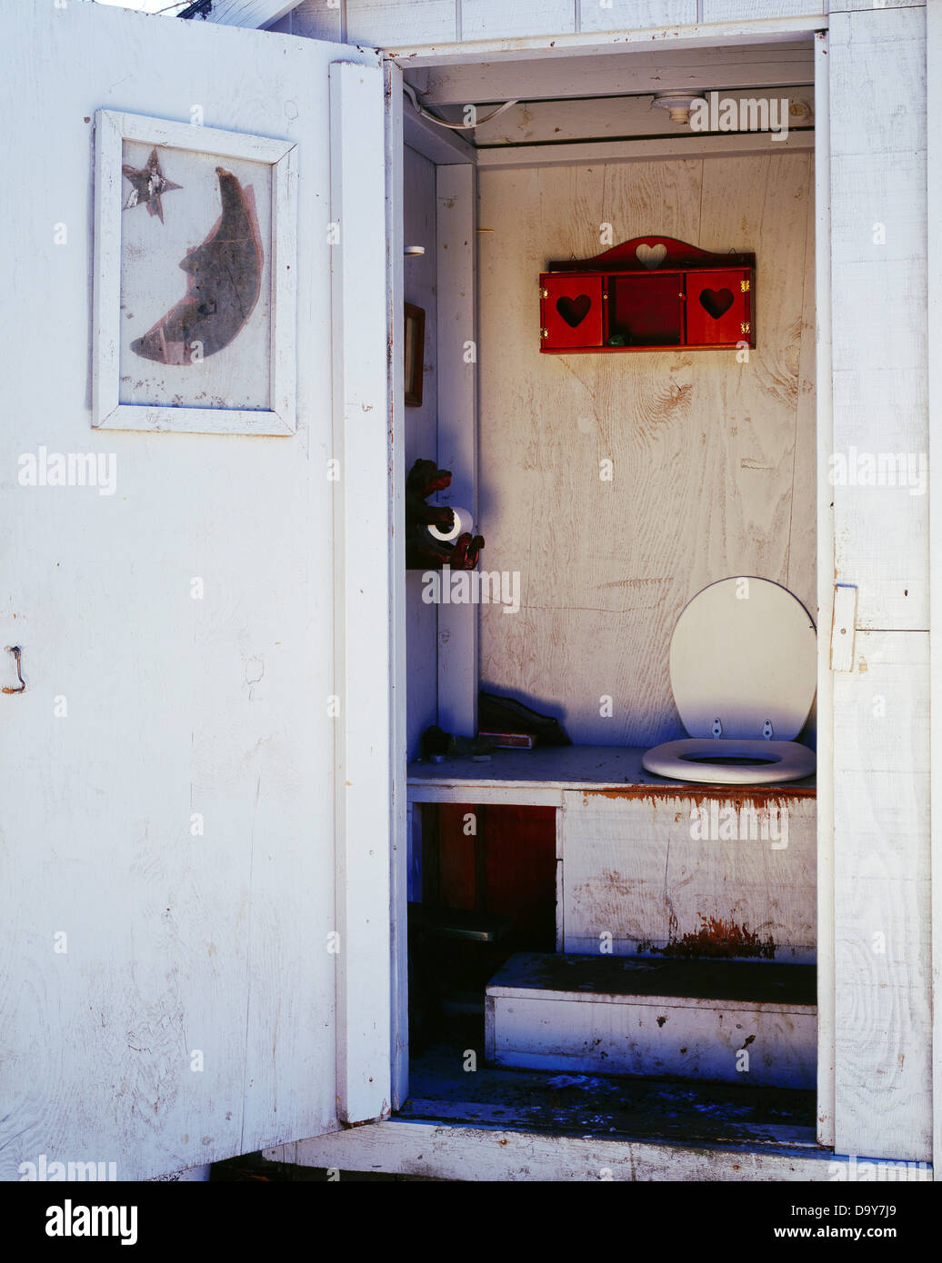 USA, Alaska, Outhouse with half moon and star at Bissell homestead near ...