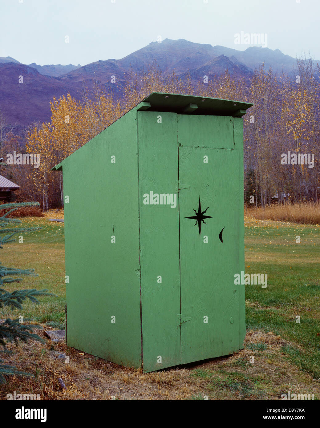 USA, Alaska, Wiseman, Modern outhouse with star and crescent moon Stock ...