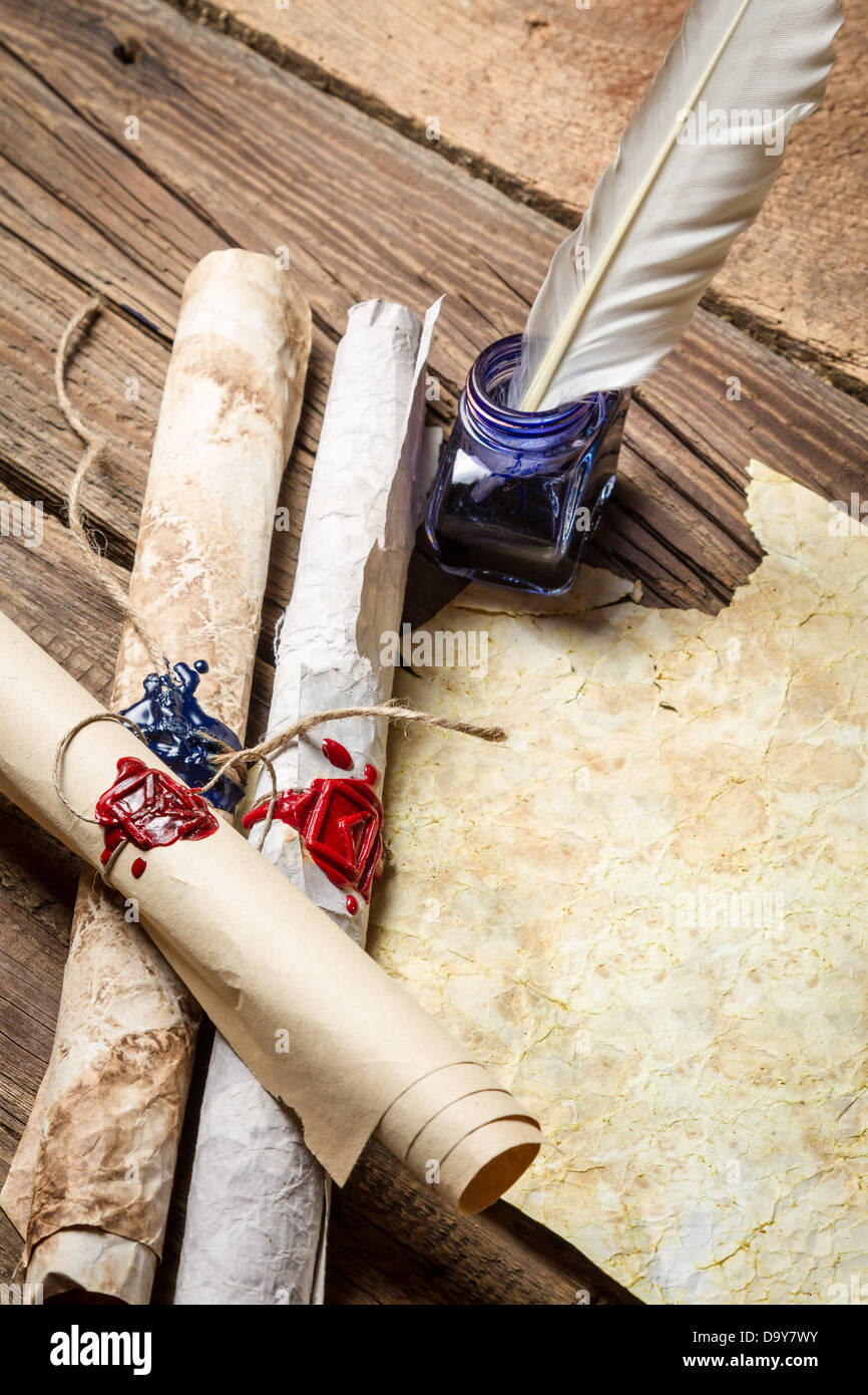 Ancient scrolls writing by feather with blue ink Stock Photo - Alamy