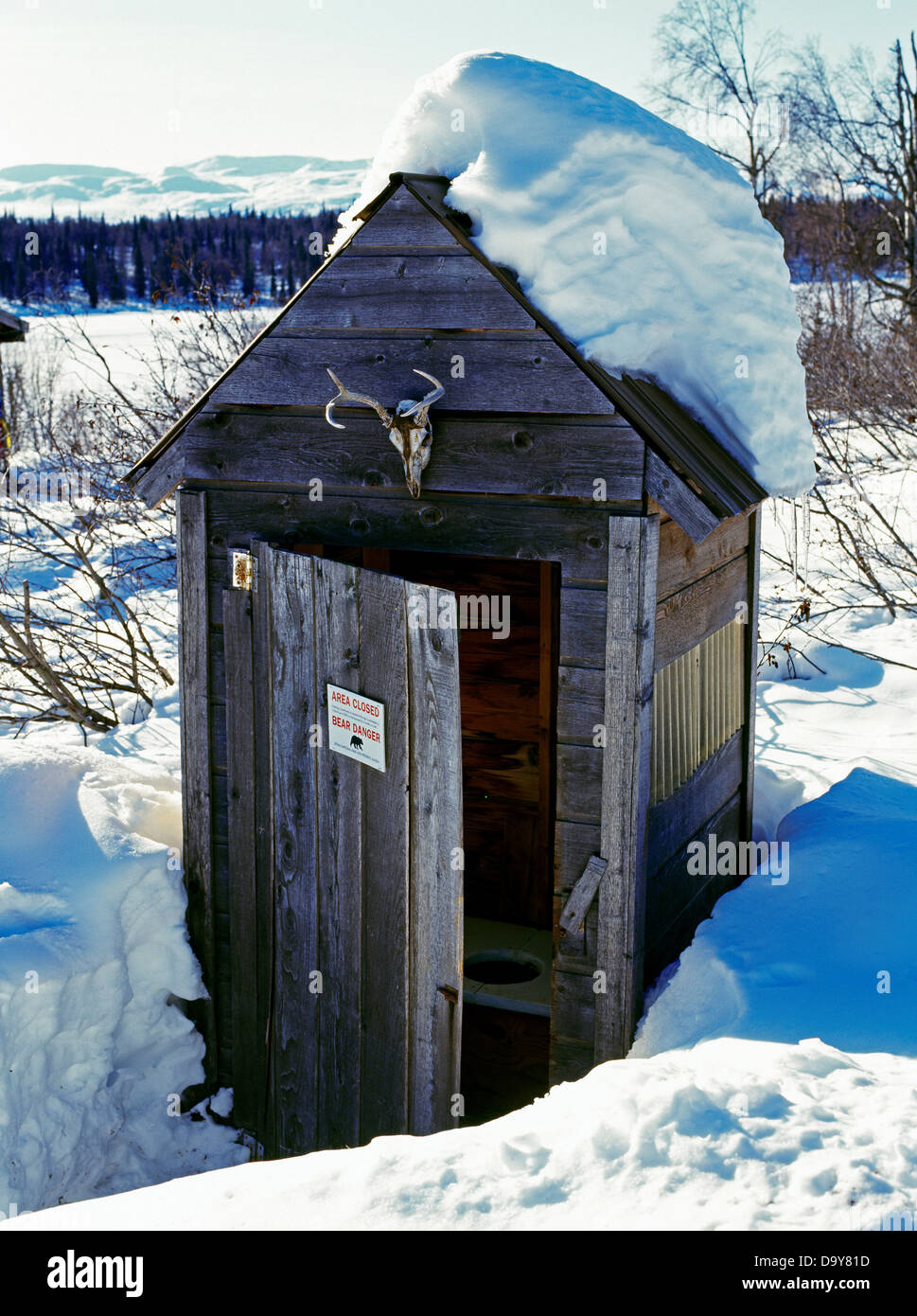 USA, Alaska, Shell Lake east of Alaska Range, Outhouse with'Area Closed ...