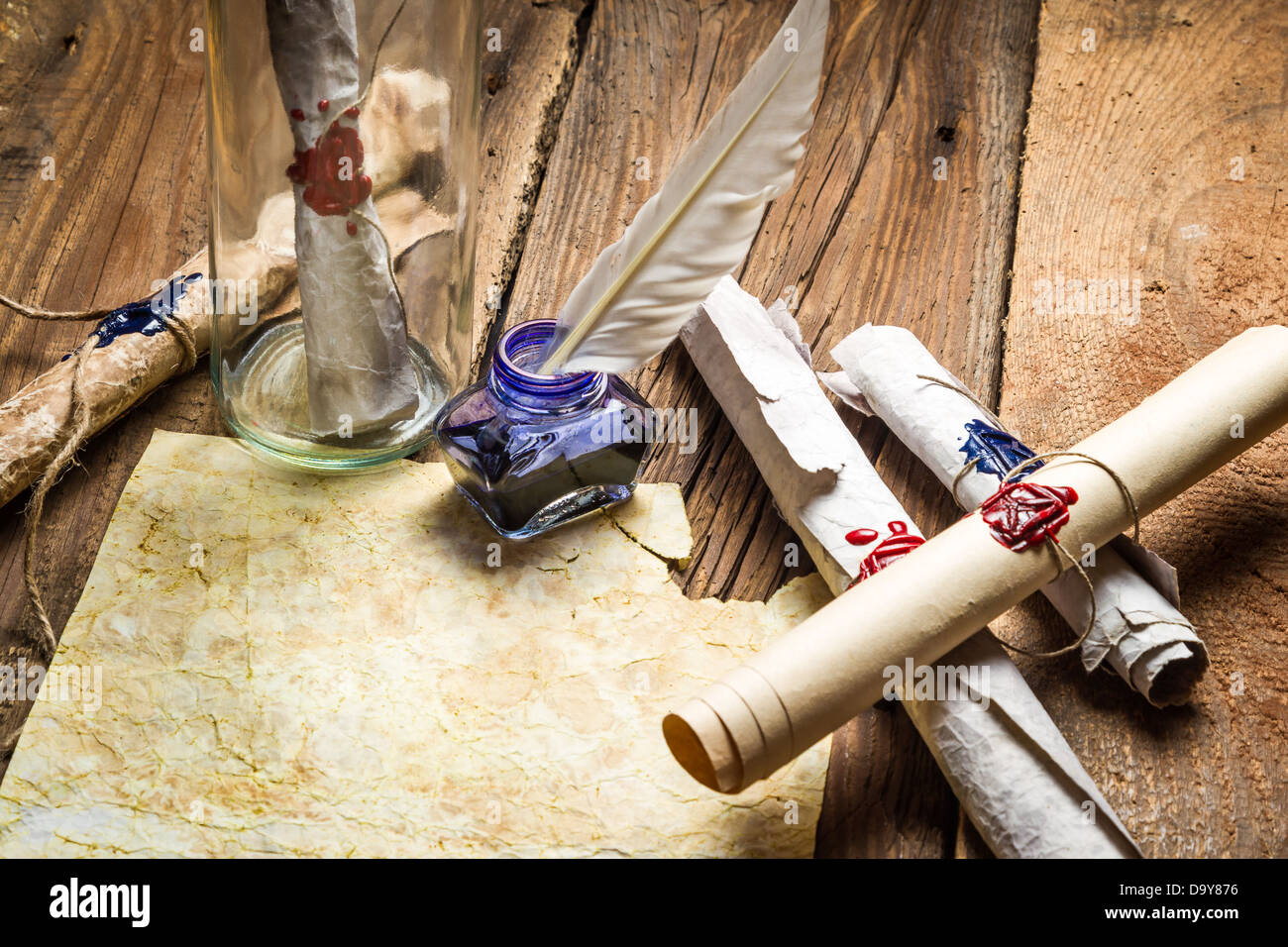 Writing ancient feather letter and send it in a bottle Stock Photo - Alamy