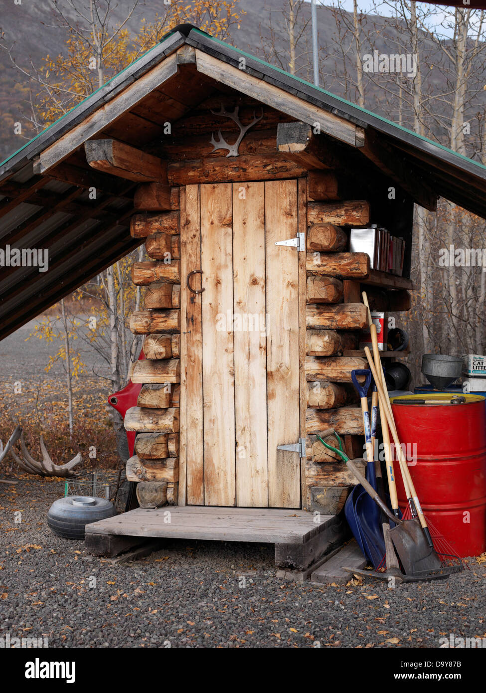 USA, Alaska, Majestic Valley, Log outhouse with oversized roof Stock ...
