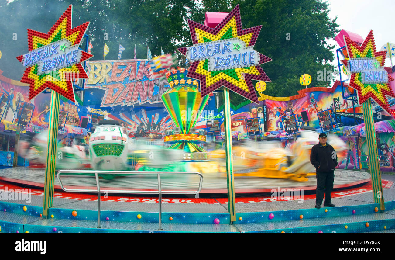 Hanover, Germany. 28th June, 2013. Visitors ride the carousel "Break ...