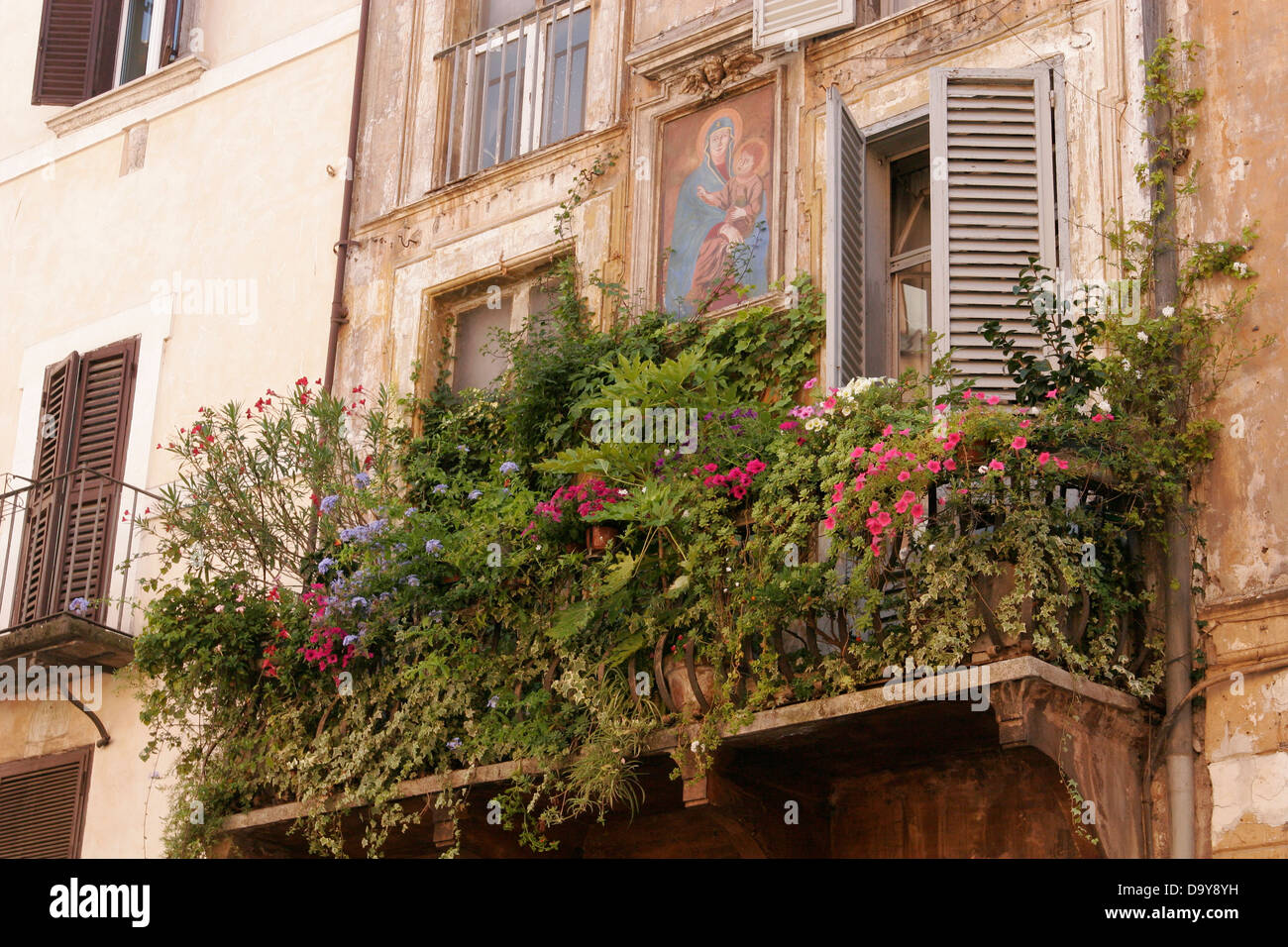 Roman balcony with the image of Virgin Mary, Rome, Italy Stock Photo ...