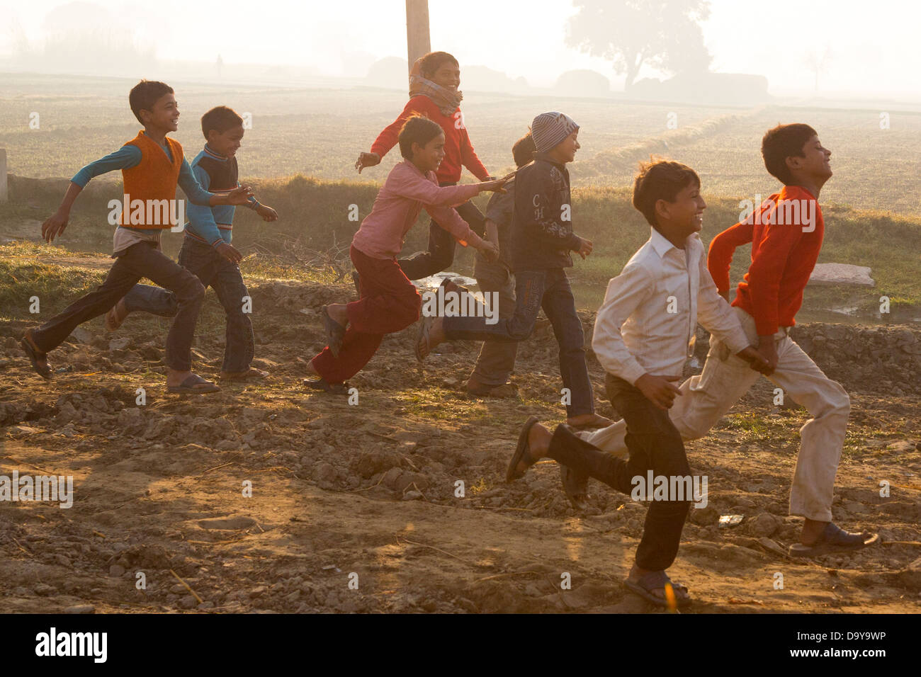 India, Uttar Pradesh, Aligarh boys running Stock Photo - Alamy