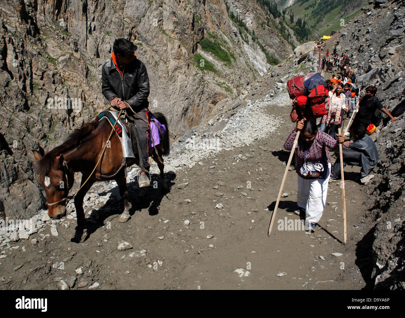 Baltal, Indian Administered Kashmir 28th June 2013.Hindu devotees walk ...
