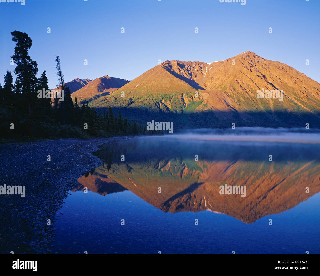 Morning reflection of the Saint Elias Mountains in Kathleen Lake ...