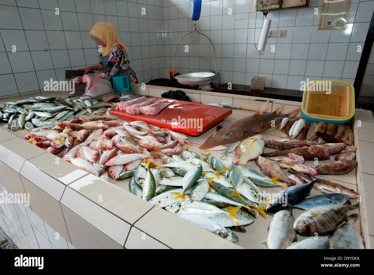 Seafood butcher cutting fish in hi-res stock photography and images - Alamy