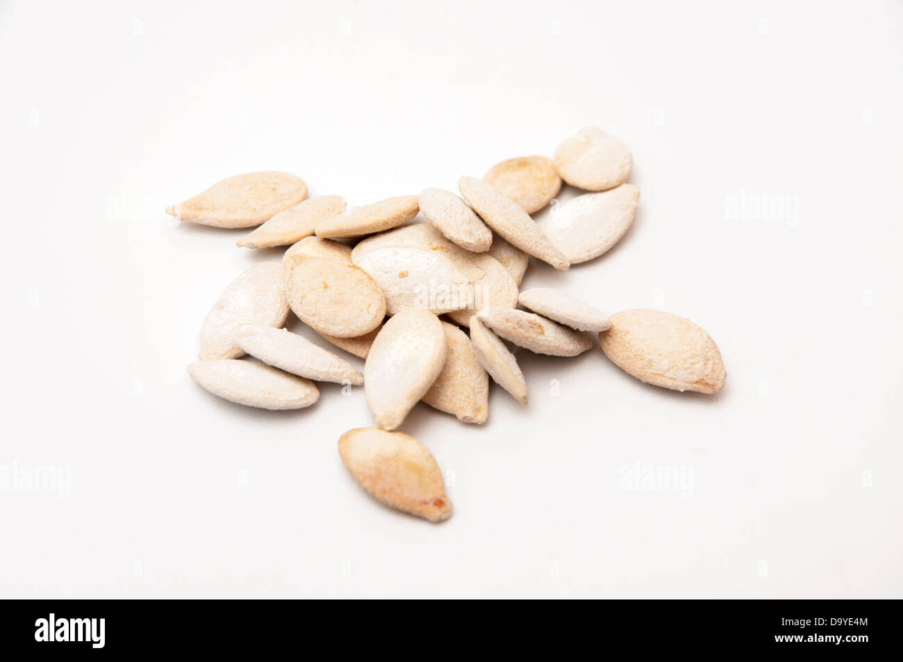 pumpkin seeds on a white background Stock Photo - Alamy